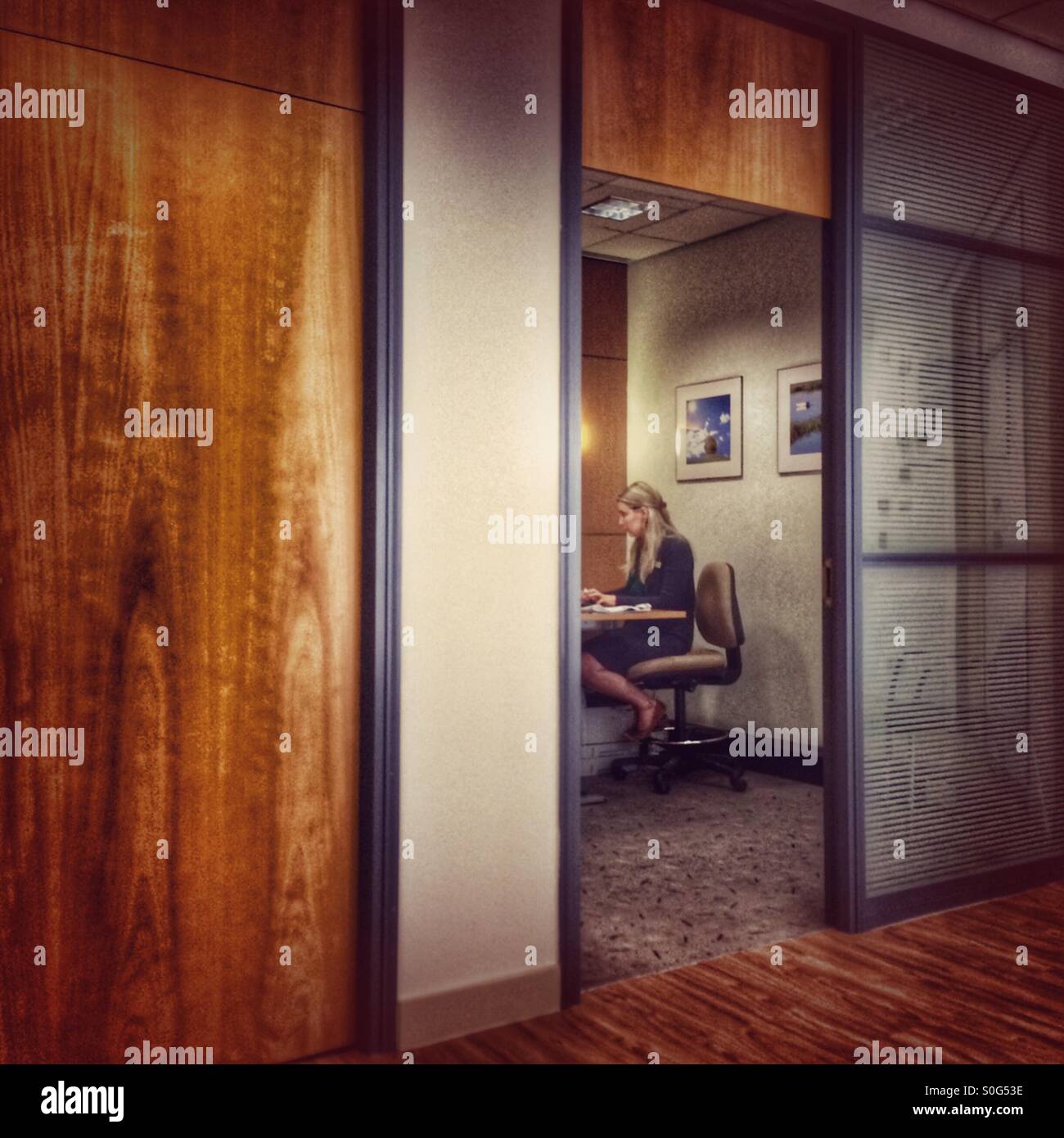 Office interior with worker Stock Photo - Alamy