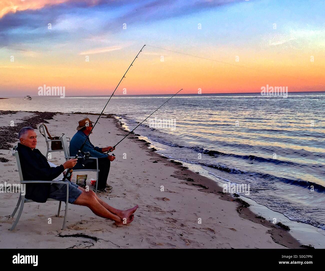 Two people fishing in Adelaide Stock Photo - Alamy