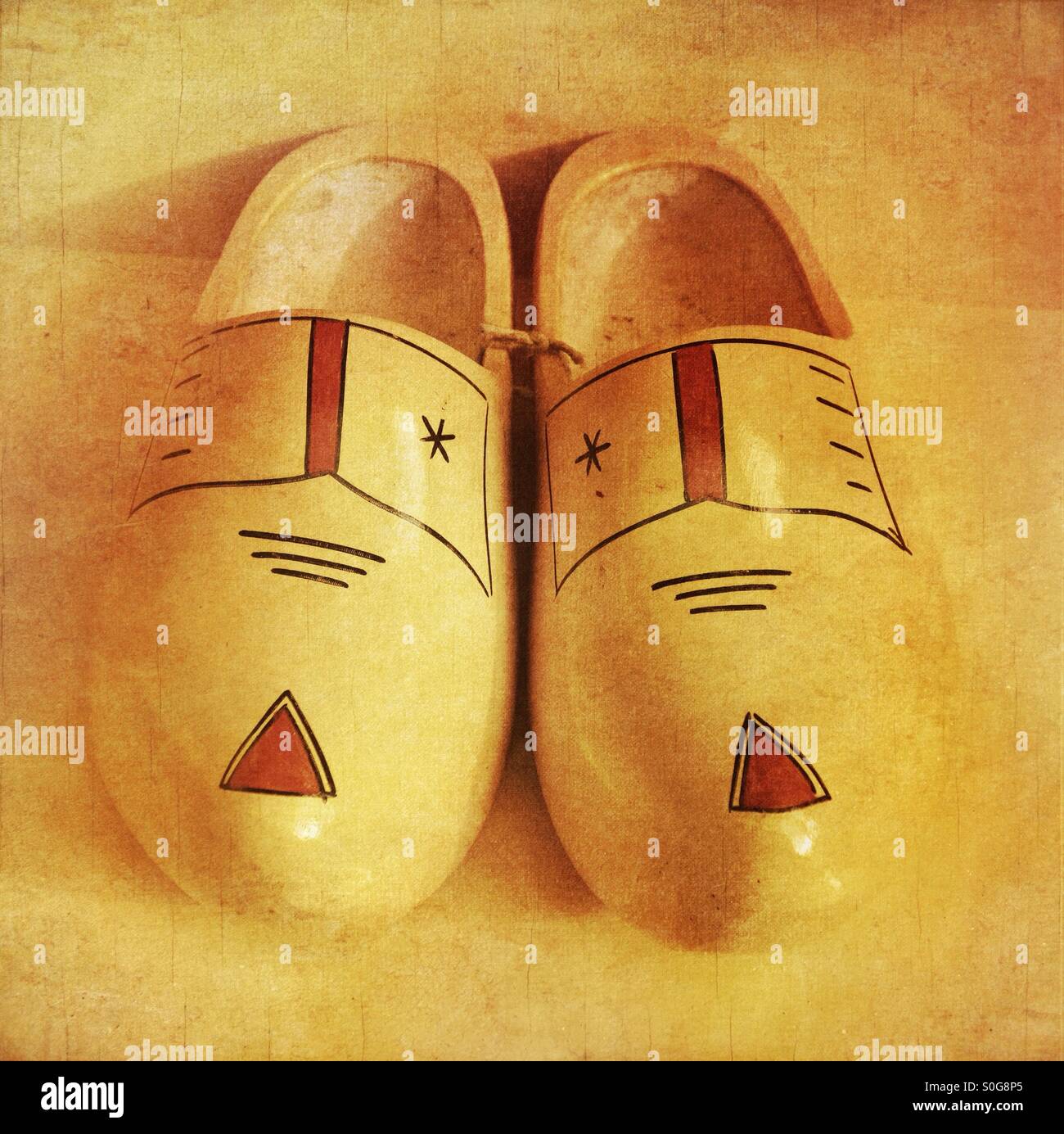 A pair of typical yellow Dutch wooden clogs Stock Photo - Alamy