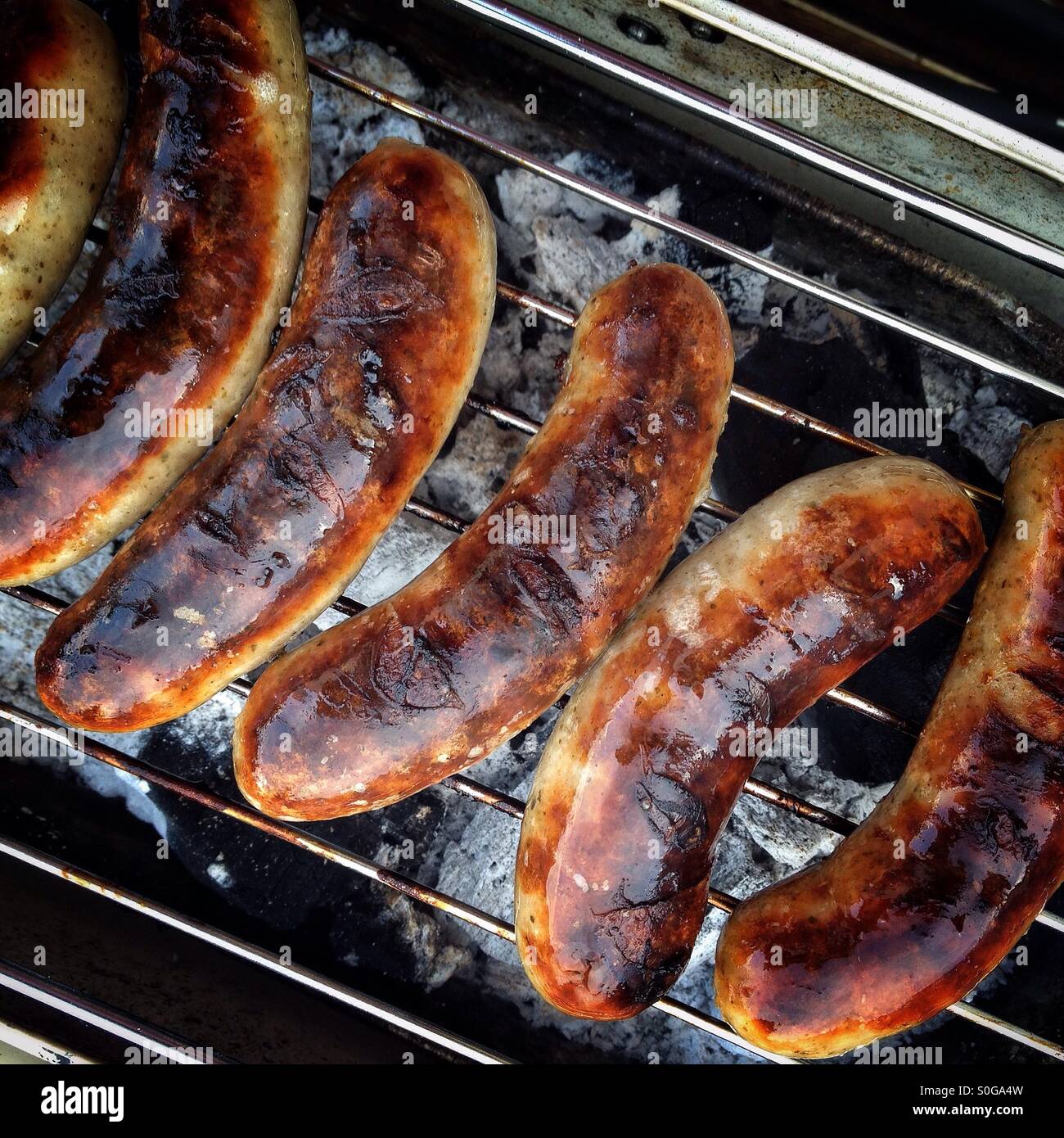 Sausages on a barbecue Stock Photo - Alamy