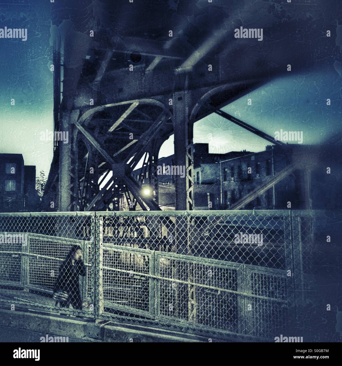Woman walks underneath the elevated train tracks in Chicago Stock Photo ...