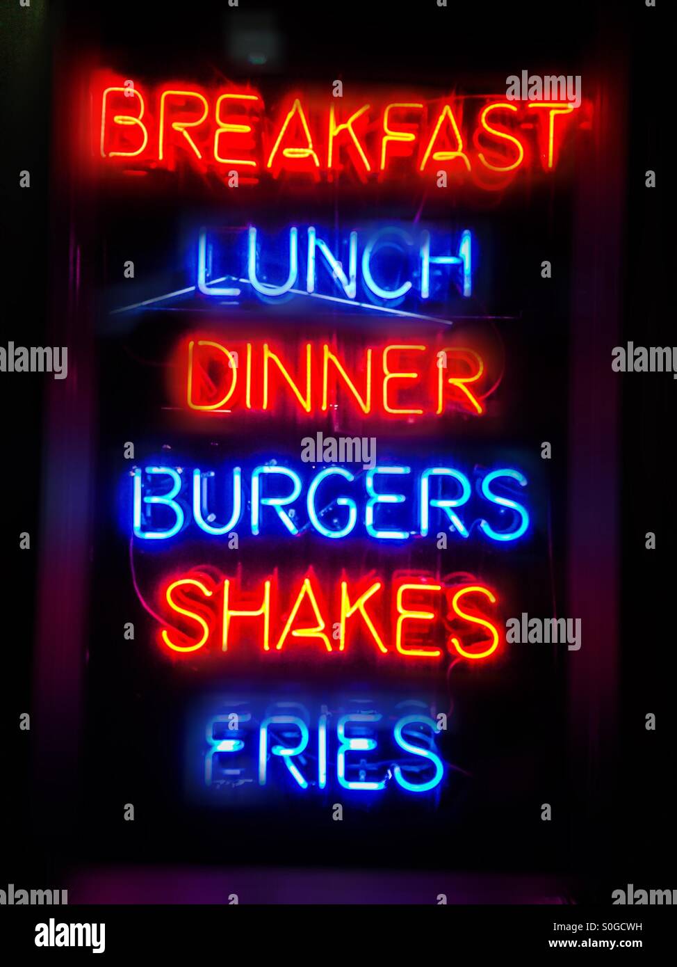 Three Meals neon signs Stock Photo - Alamy
