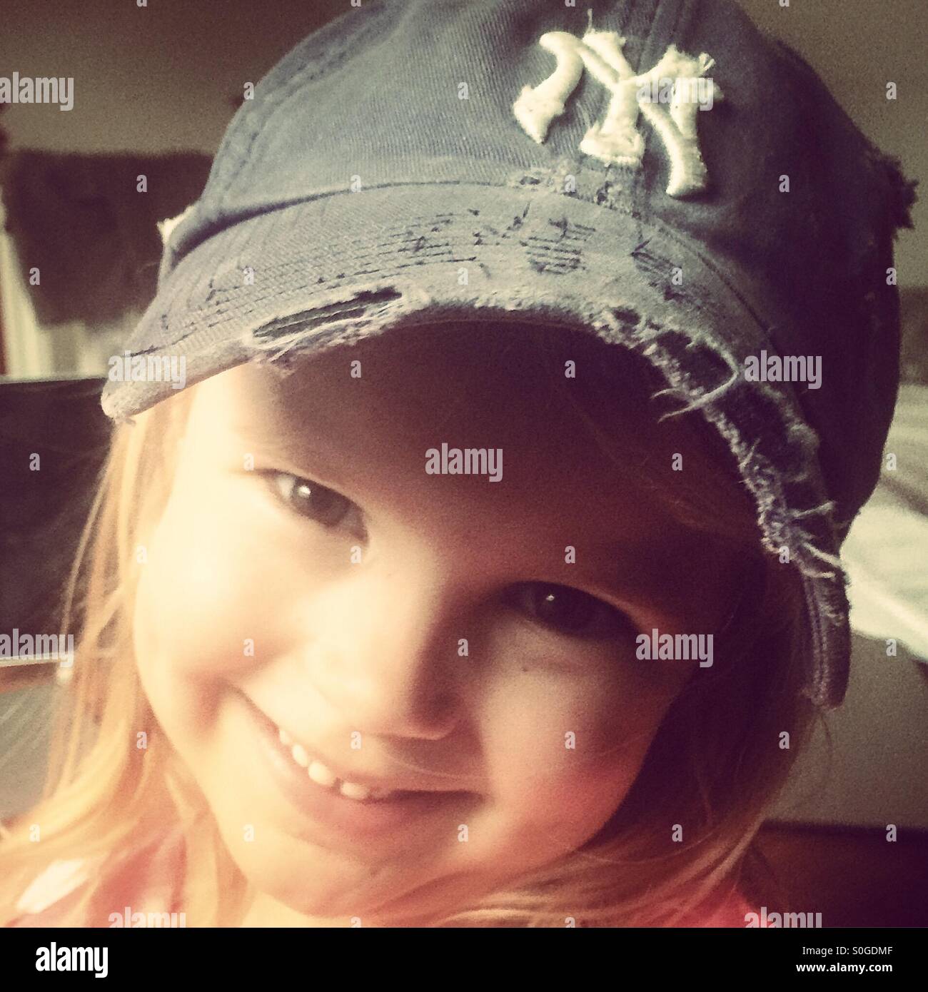 Girl baseball cap smiling hi-res stock photography and images - Alamy