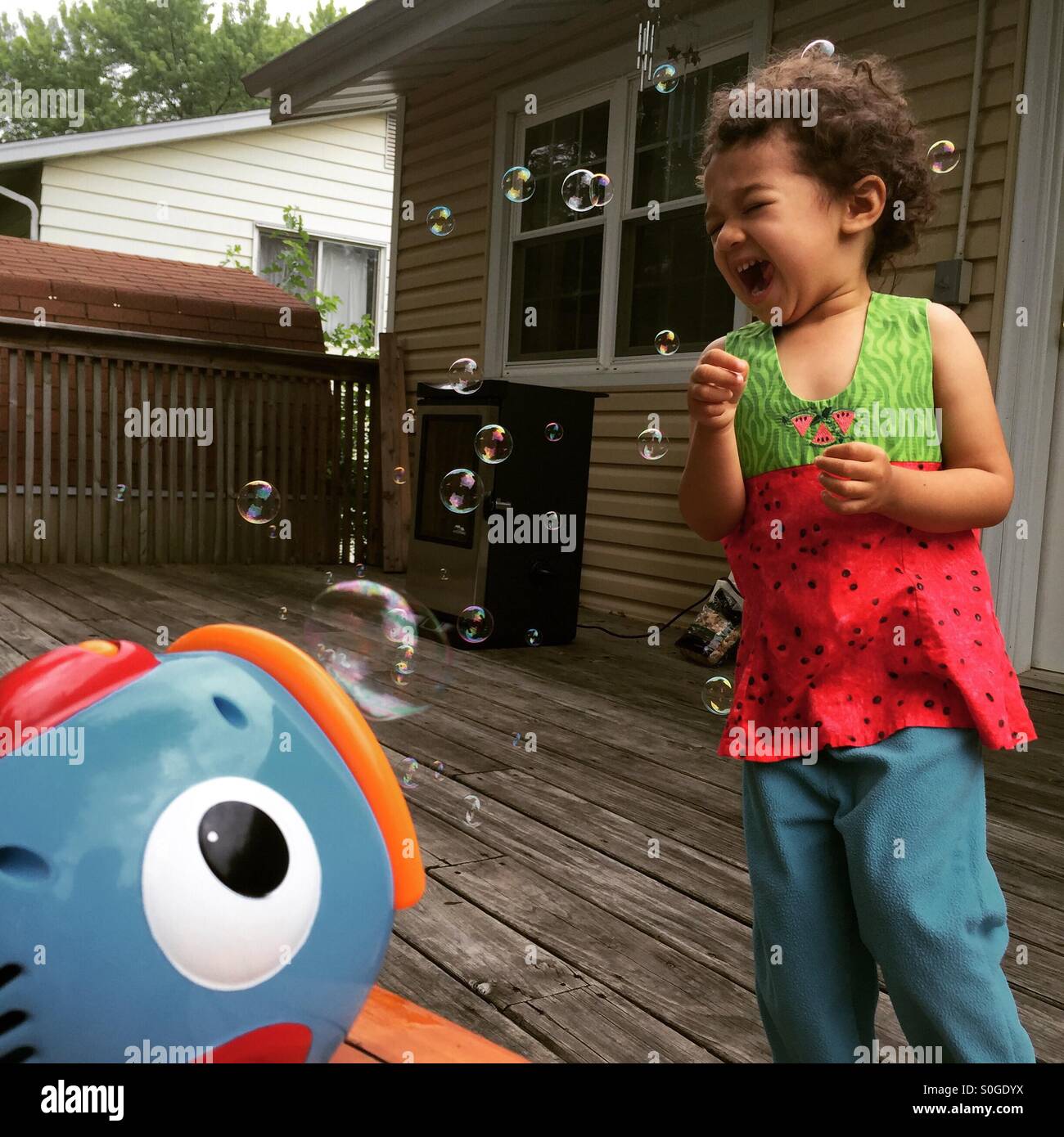 Kids Chasing Bubbles High Resolution Stock Photography and Images - Alamy