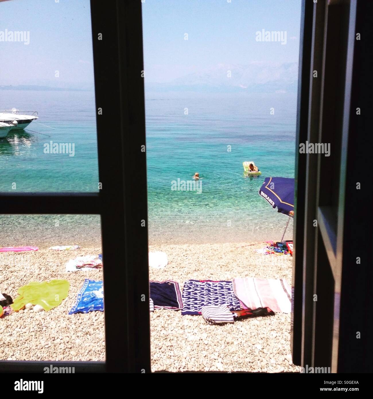 Sea view from window with people hi-res stock photography and images ...