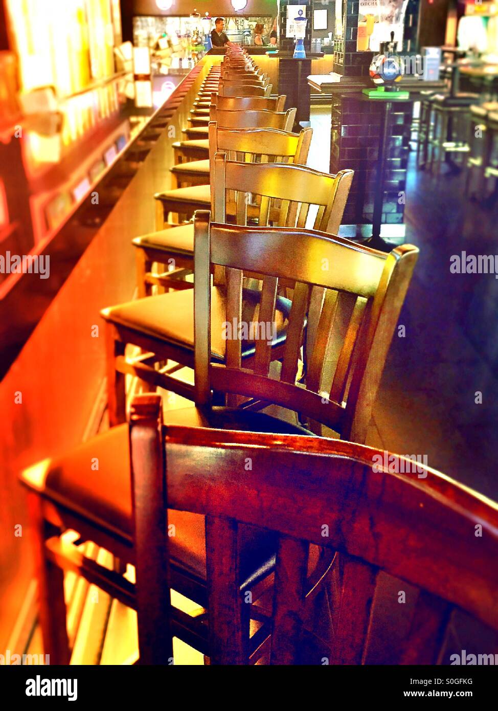 Row of bar stools hi-res stock photography and images - Alamy