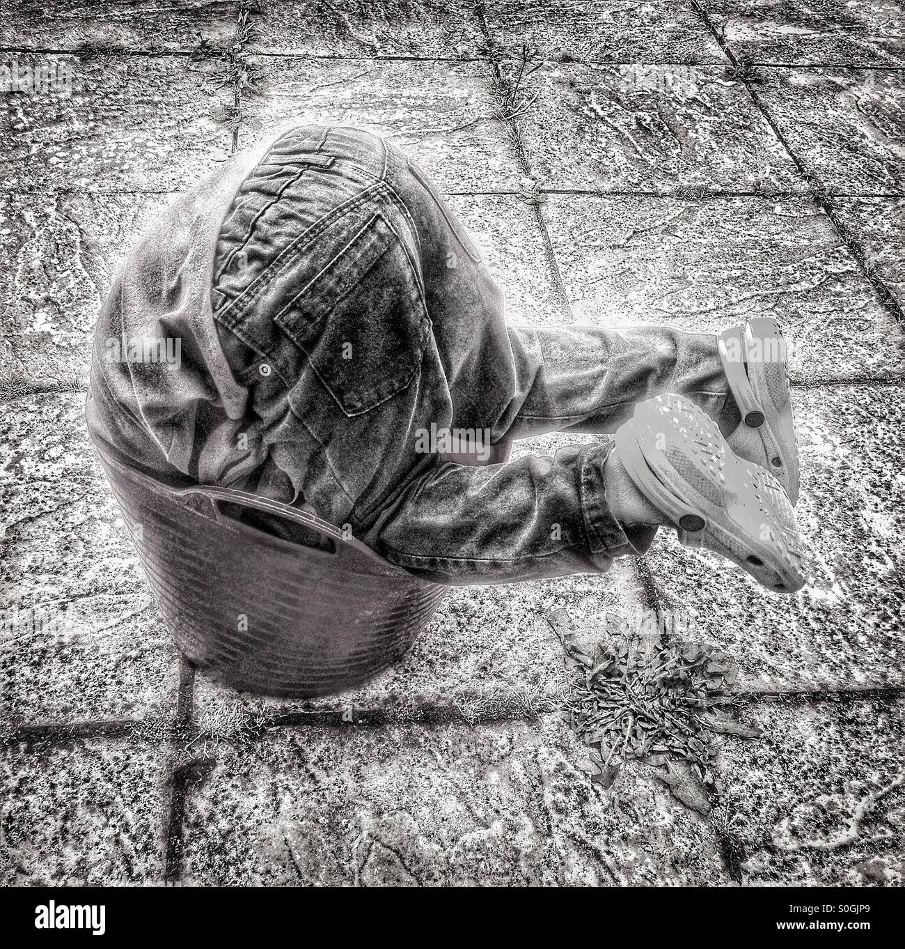Child in bucket hi-res stock photography and images - Alamy