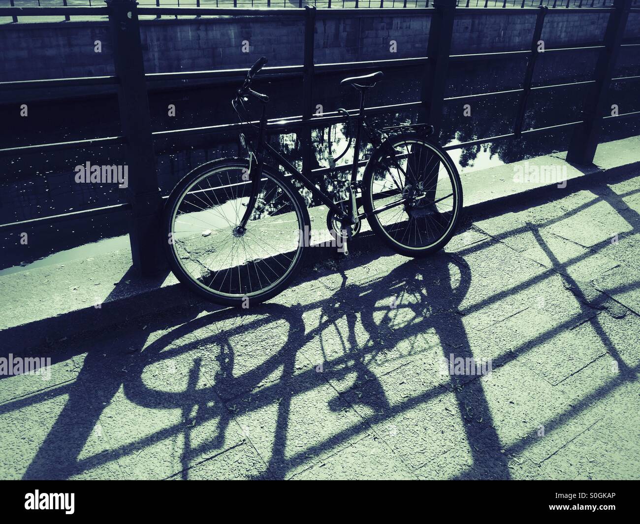 Locked bicycle by river spree Berlin Stock Photo - Alamy