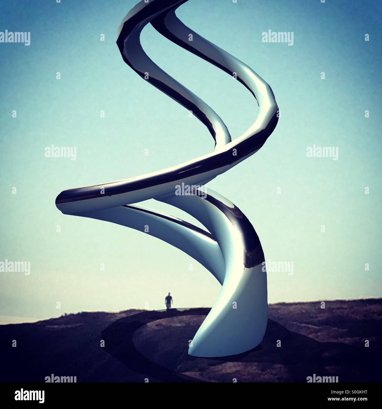 Man with giant spiral Stock Photo - Alamy