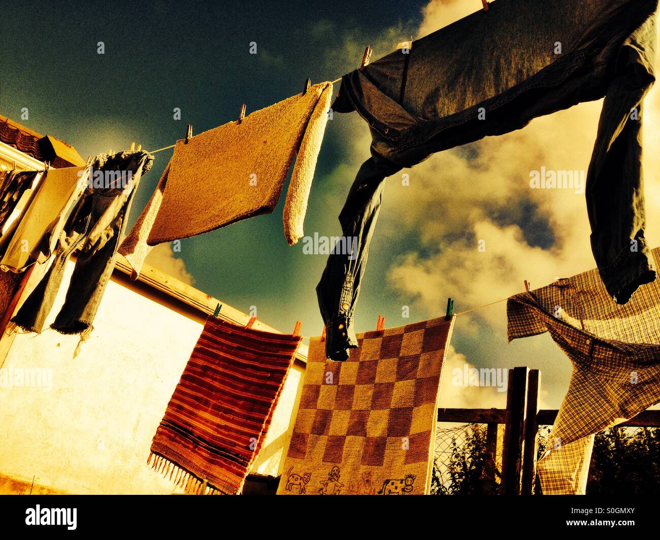 Clothes drying online Stock Photo - Alamy