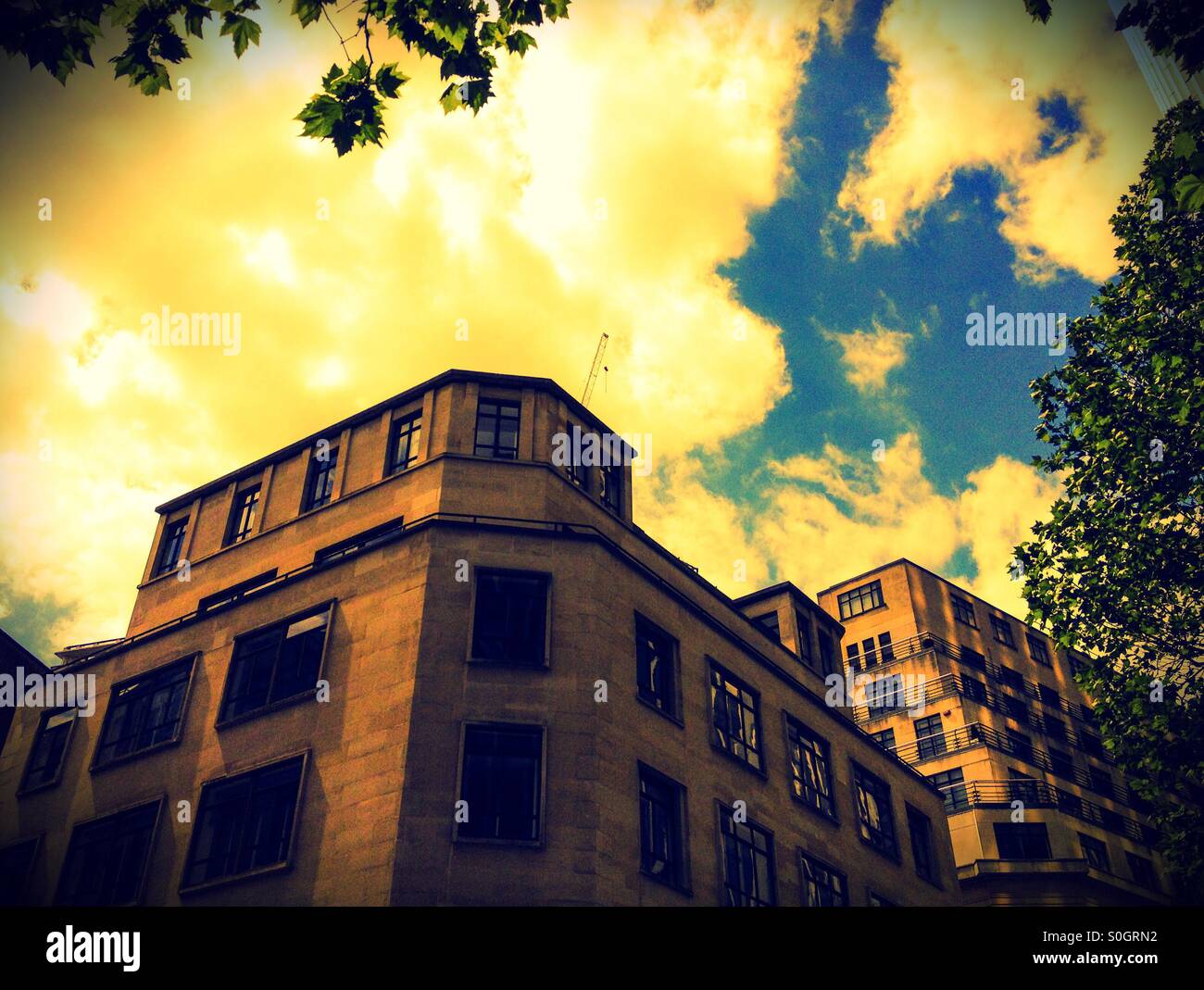 Sun setting on buildings in the city of London Stock Photo - Alamy
