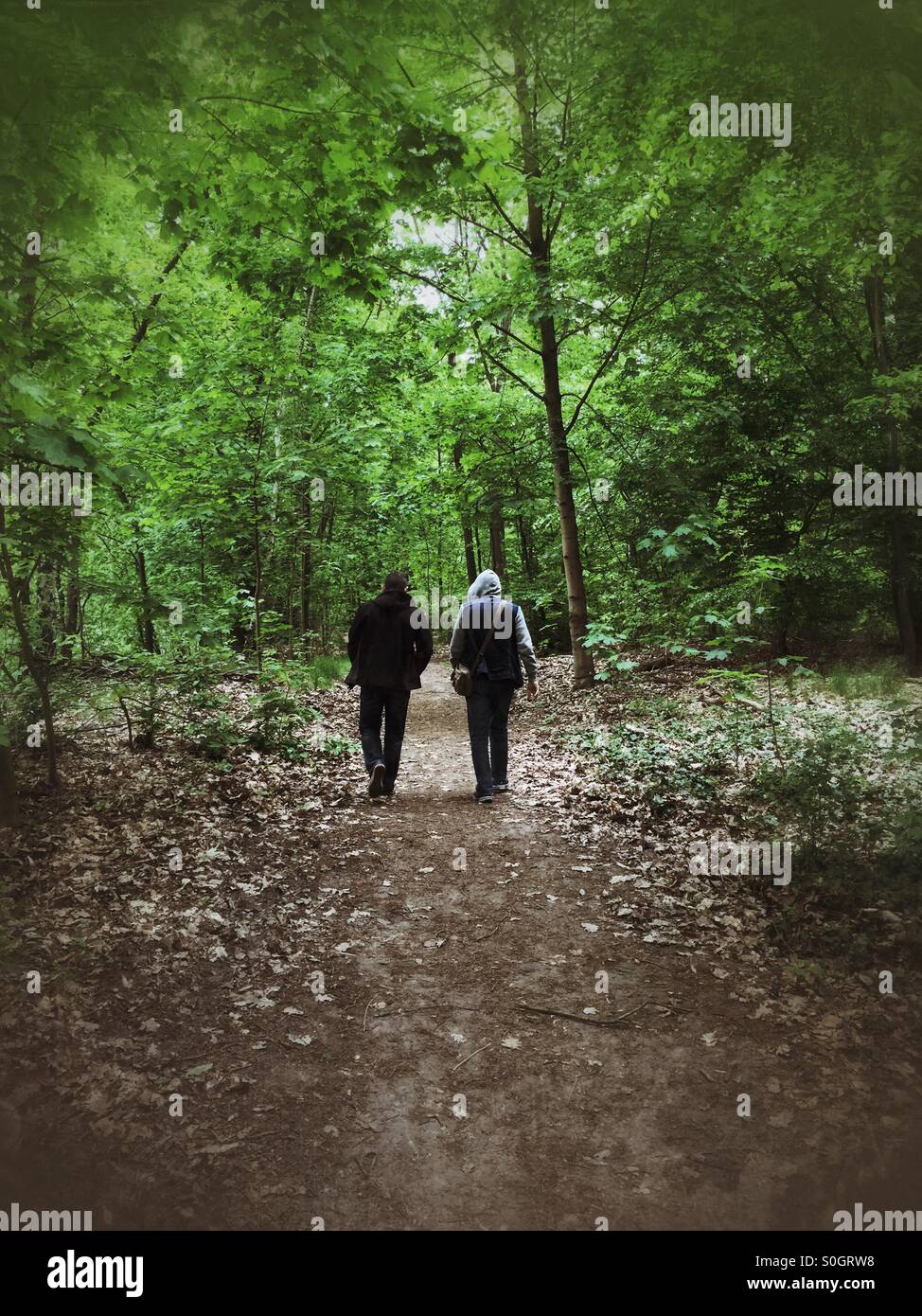Two men walking together hi-res stock photography and images - Alamy
