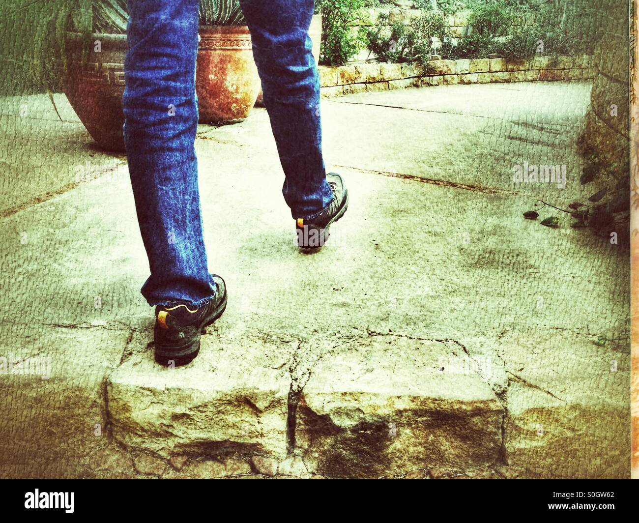 Man walking down path Stock Photo - Alamy