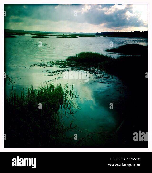 Dramatic sunset over salt marsh Stock Photo - Alamy