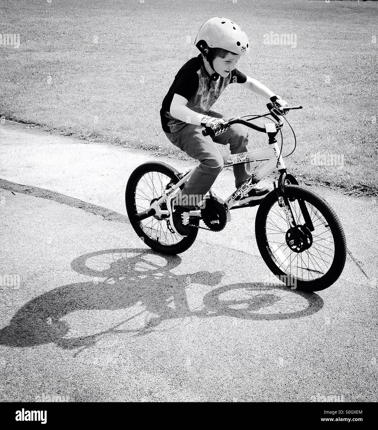 Boy riding his bicycle hi-res stock photography and images - Alamy