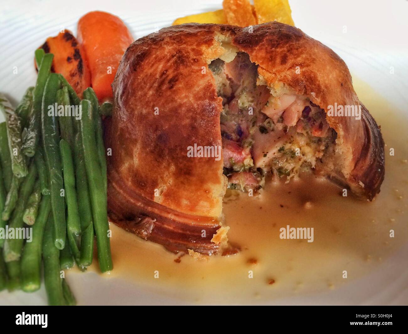 Main course of ham pie with vegetables Stock Photo - Alamy