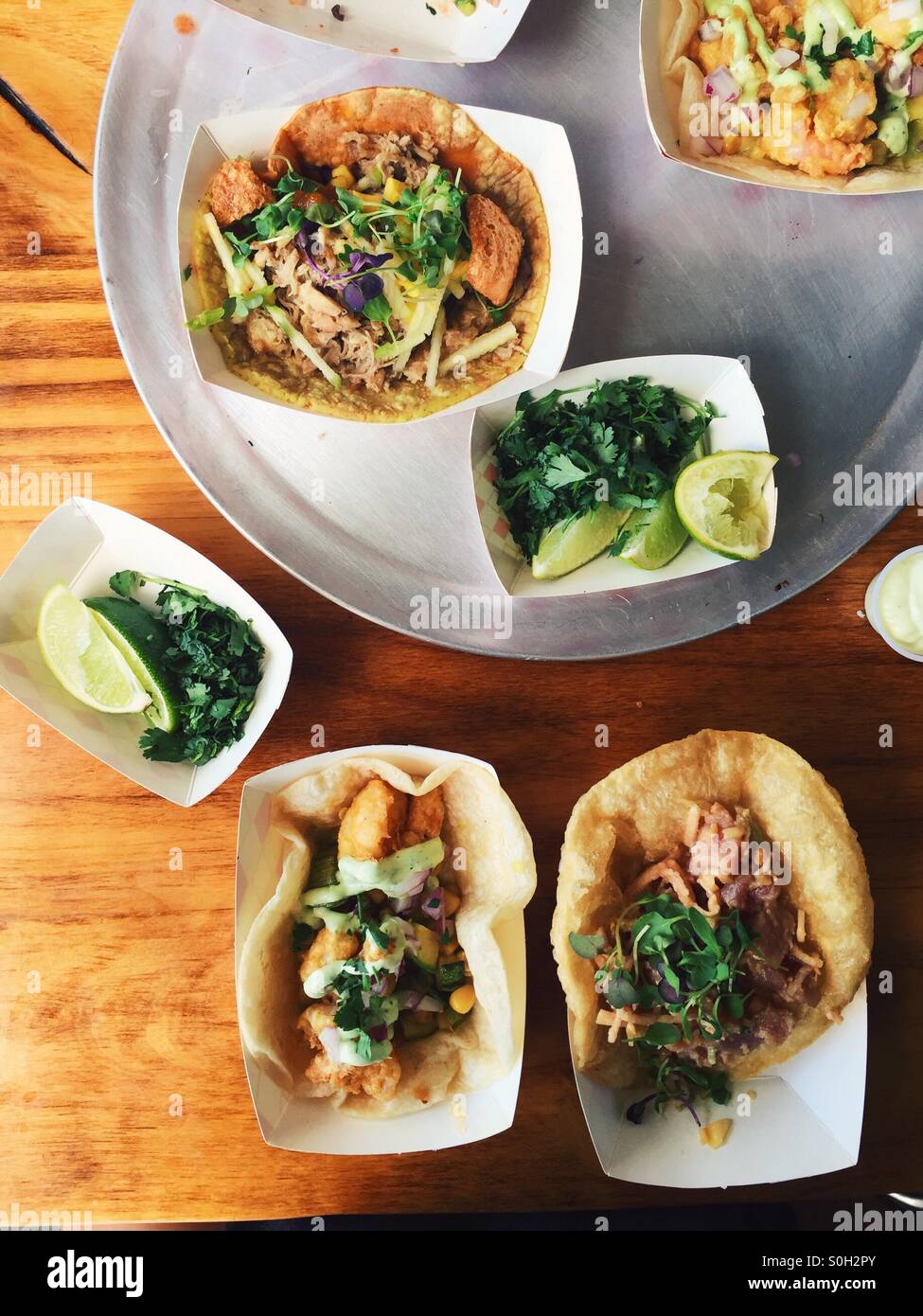 Overhead view of tacos and garnish Stock Photo - Alamy
