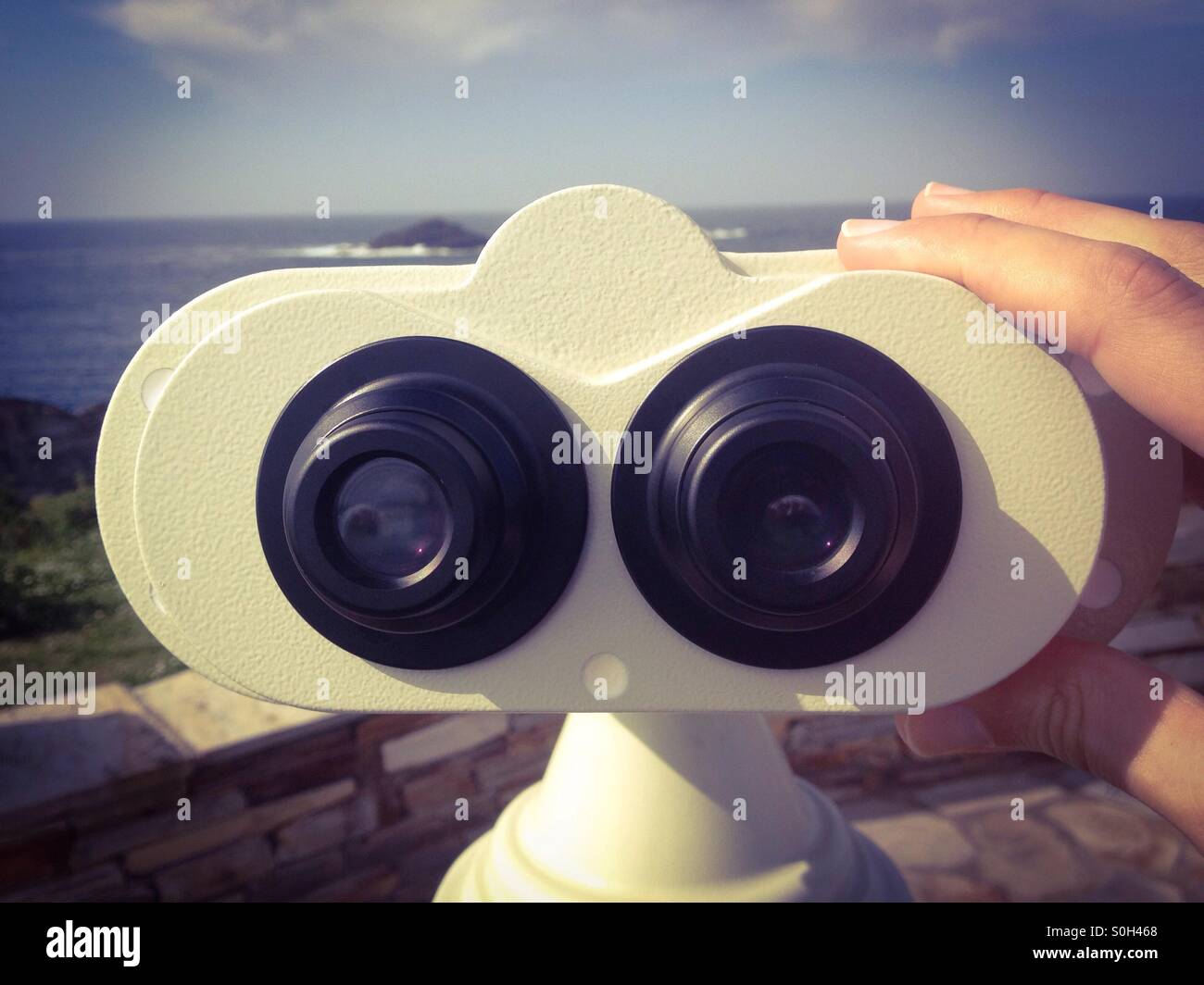 A tourist using a binocular Stock Photo - Alamy