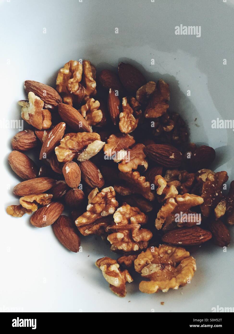Bowl full of healthy mixed nuts Stock Photo - Alamy