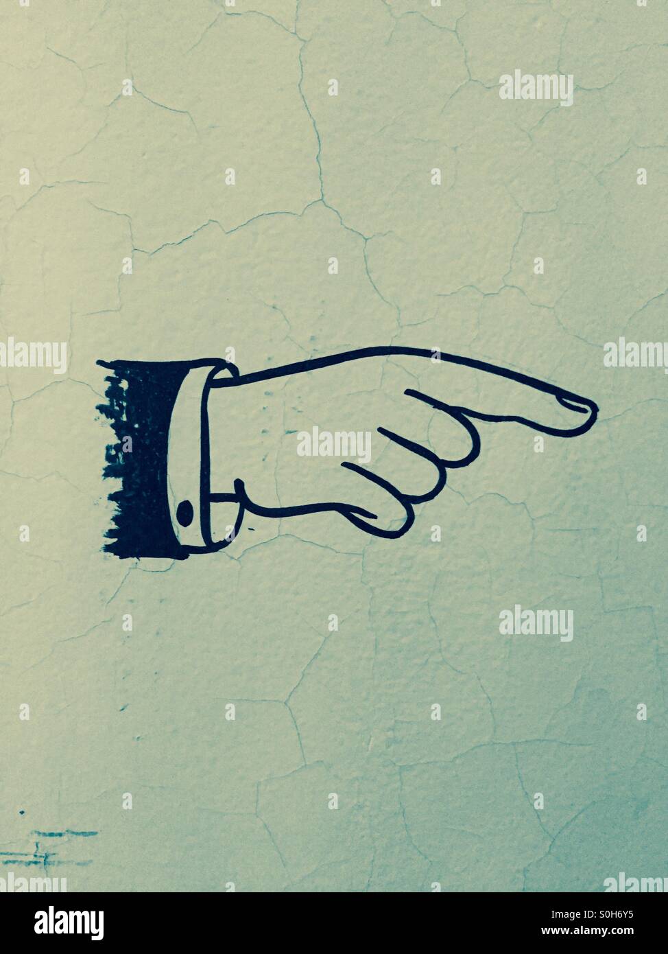 Pointing hand, painted sign Stock Photo - Alamy