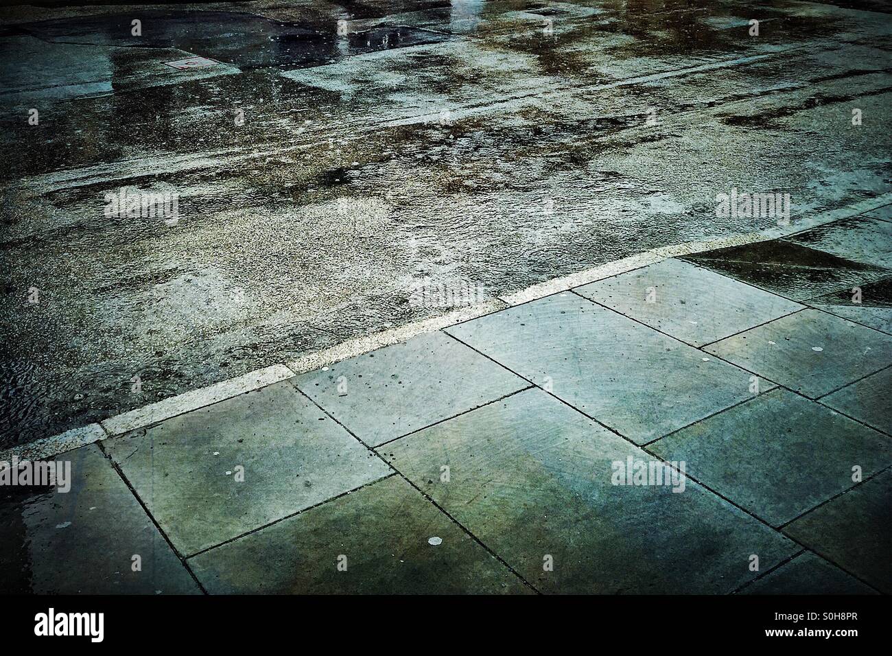 Wet pavement in the rain Stock Photo - Alamy