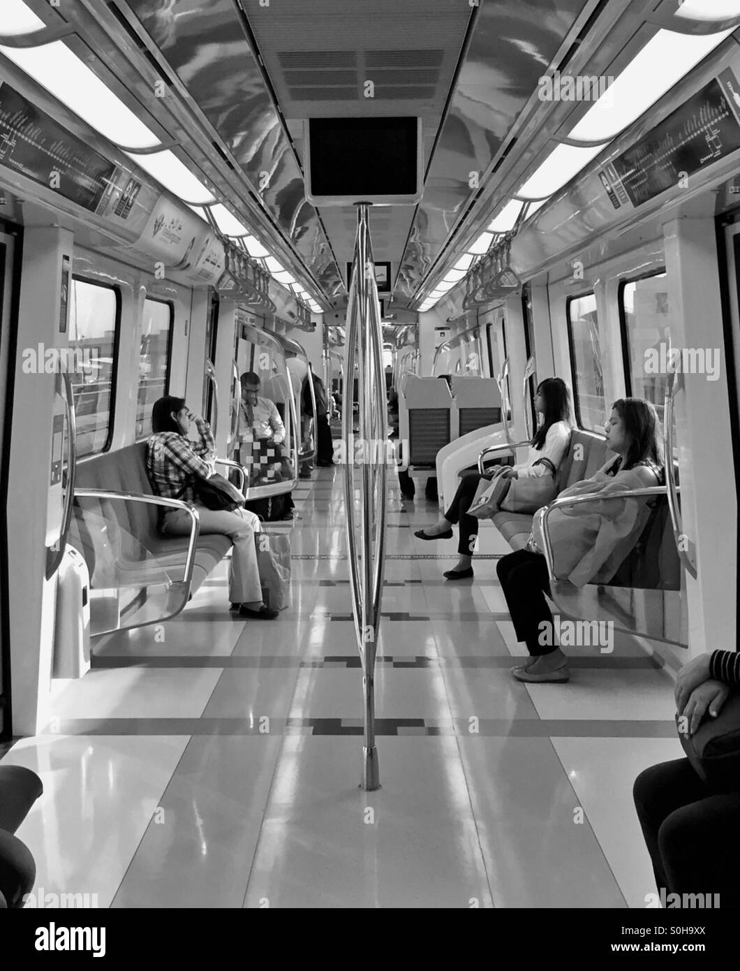 Taking the metro on the way to work Stock Photo - Alamy