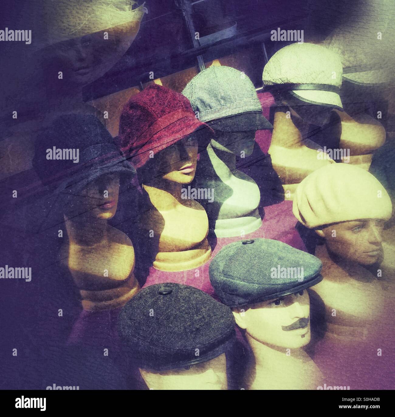 Hat shop with model heads in the window display Stock Photo - Alamy