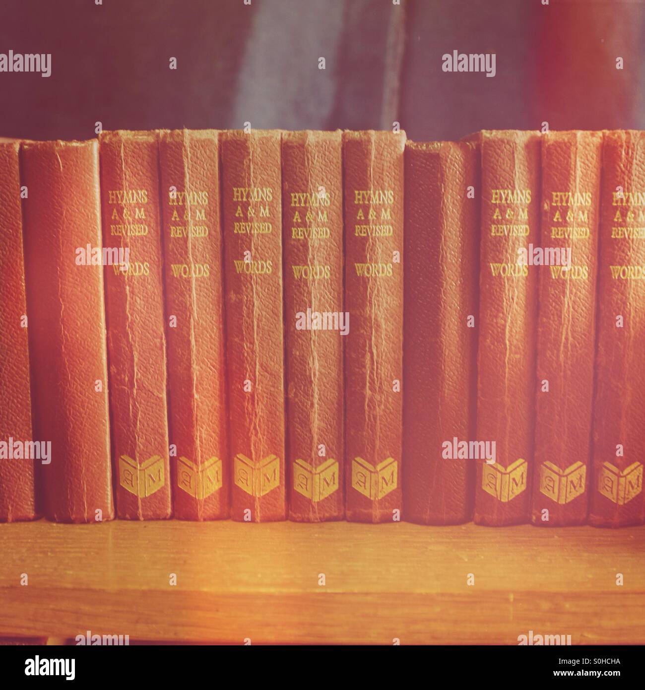 A line of old christian hymn books Stock Photo - Alamy