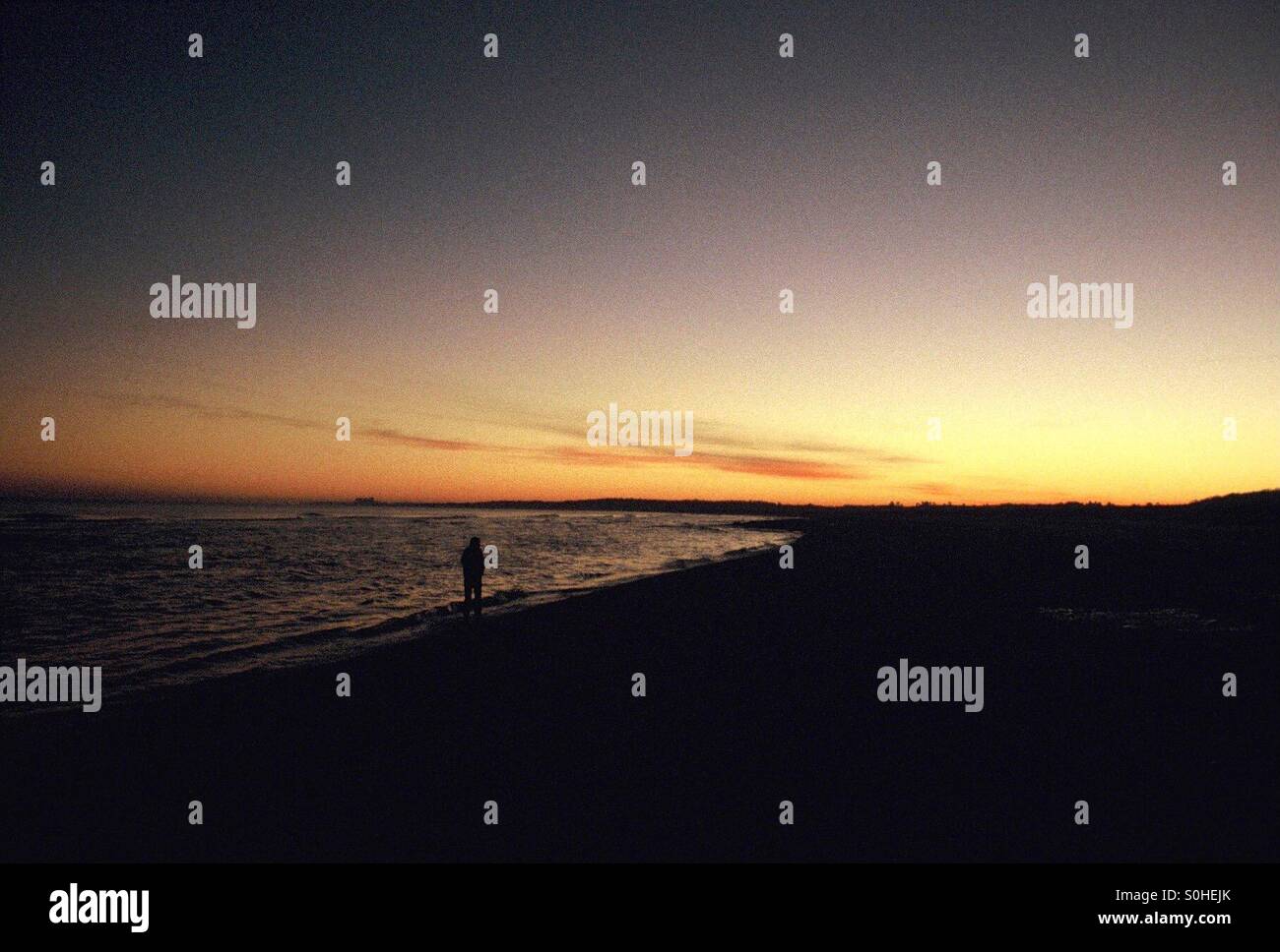 Lone person in sunset hi-res stock photography and images - Alamy