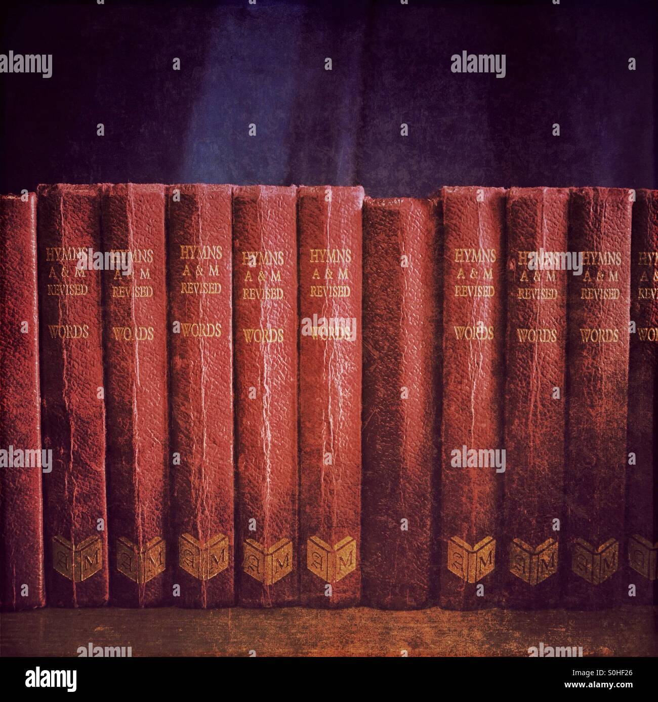 Sunday service - a row of old Christian hymn books in a church Stock ...