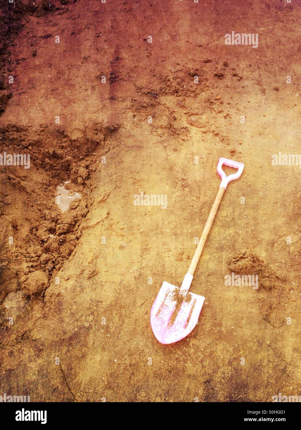 Spade on beach Stock Photo - Alamy