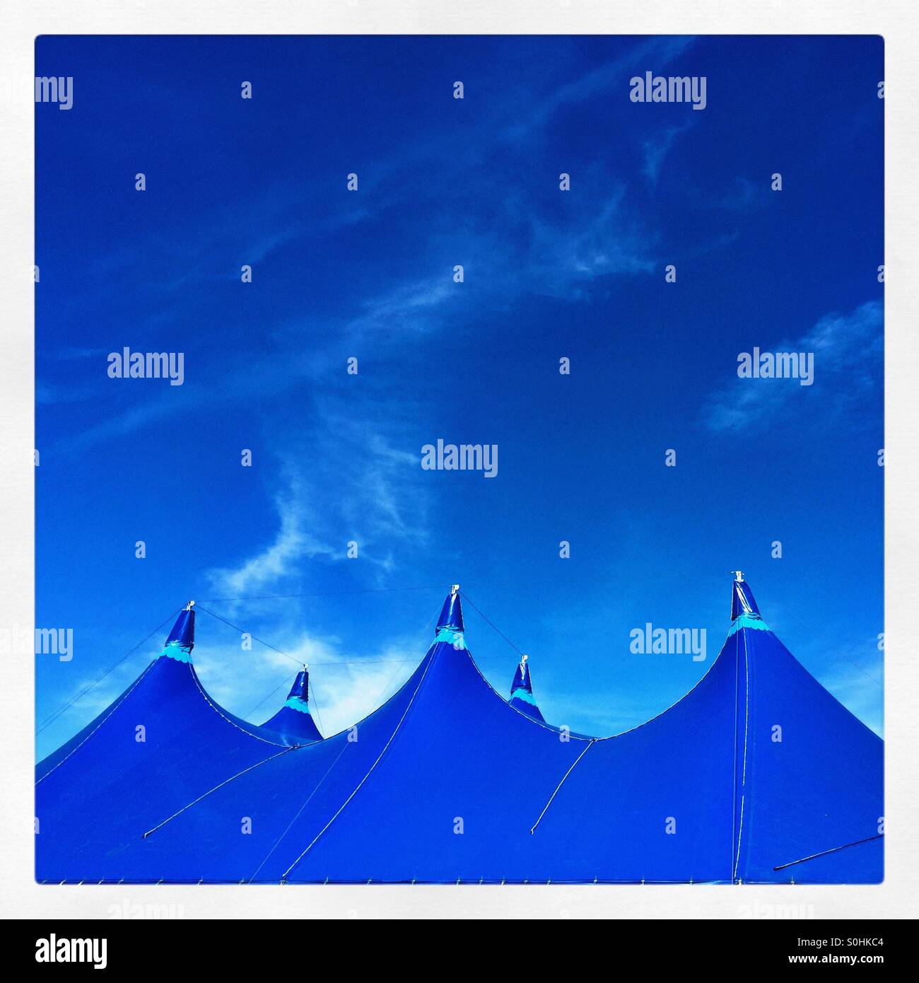 Blue marquee against a blue sky Stock Photo - Alamy