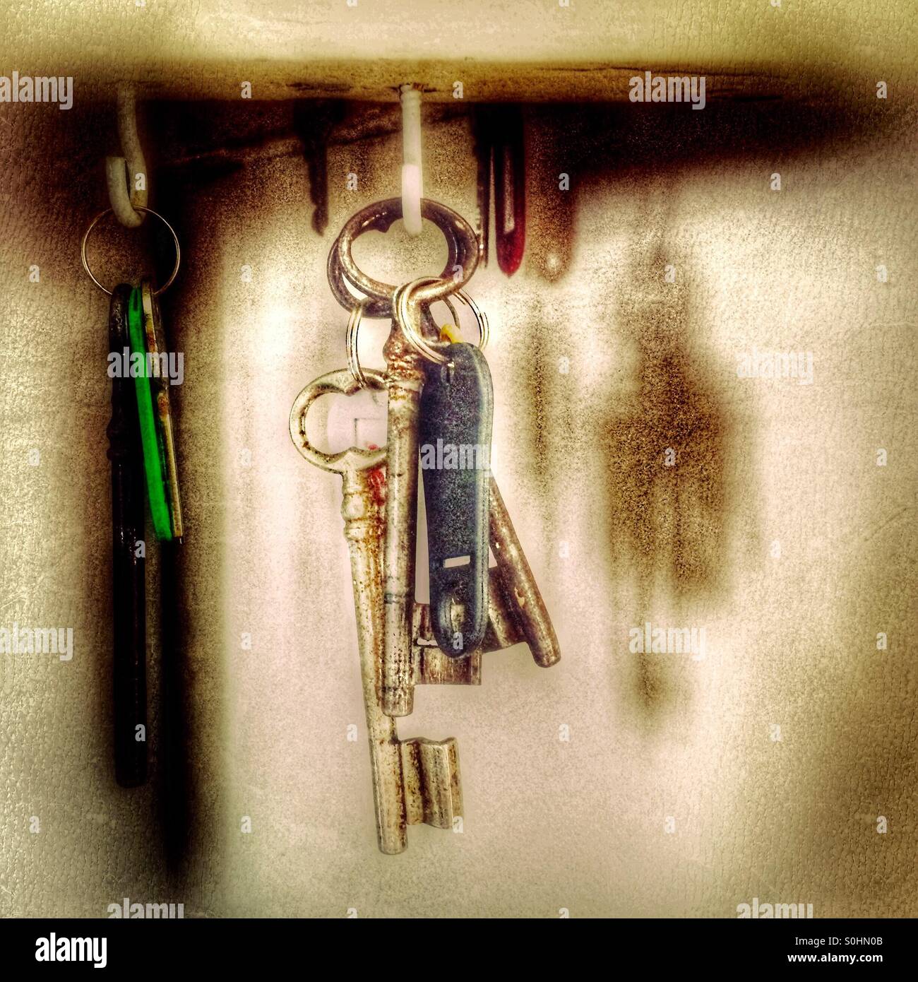 Keys hanging on rack Stock Photo - Alamy