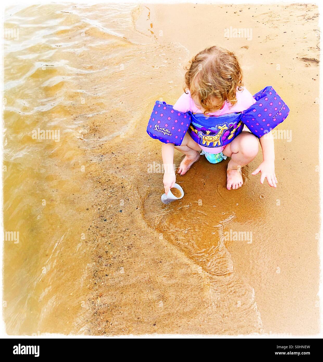 Toddler playing with sand hi-res stock photography and images - Alamy