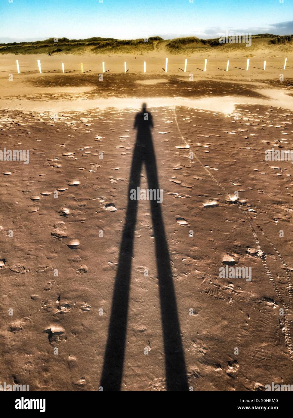 Playing with shadows at the beach Stock Photo - Alamy