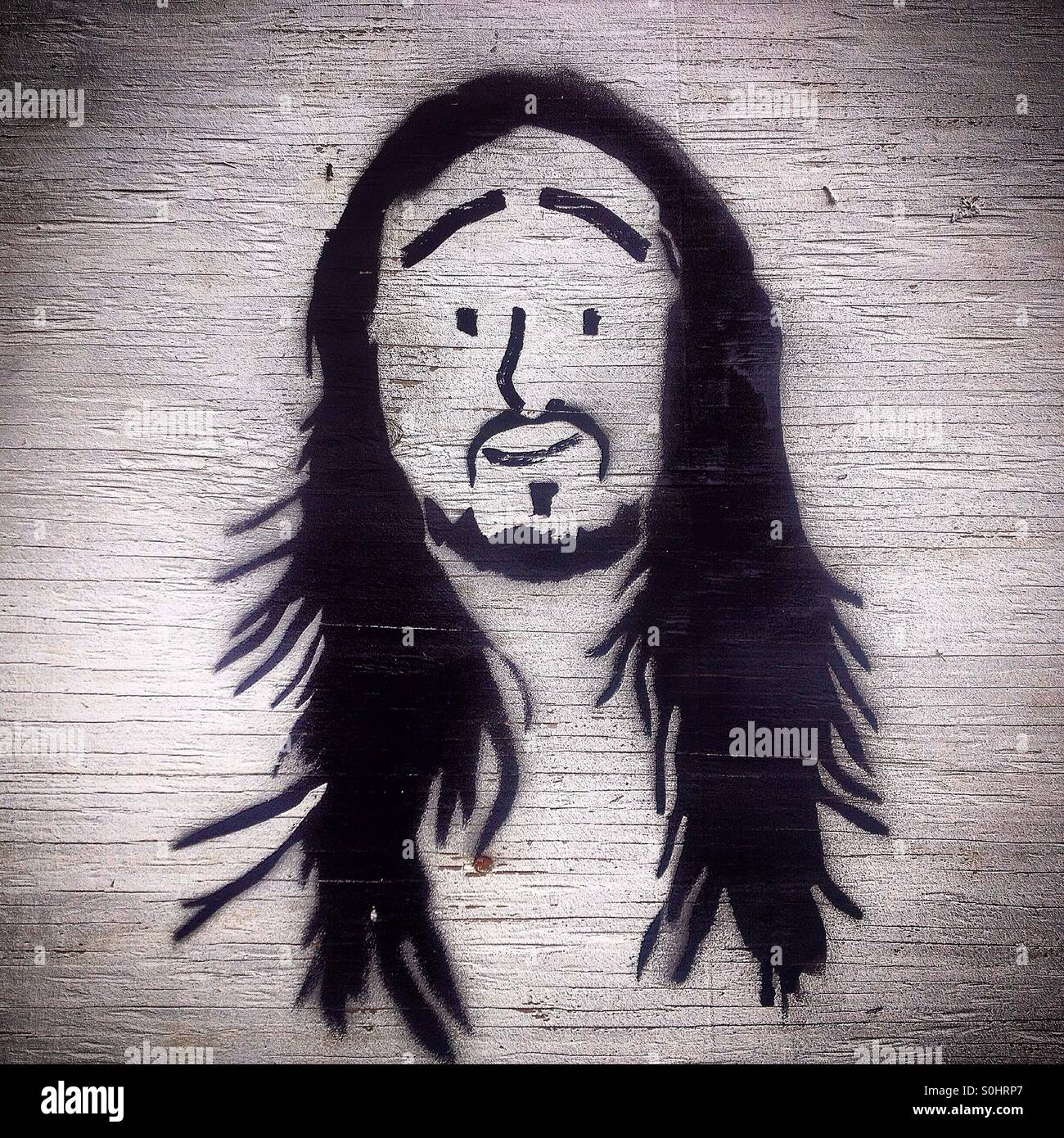 A graffiti of a faceless man painted with human face features in ...