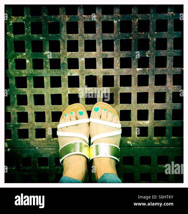 Feet on grate hi-res stock photography and images - Alamy