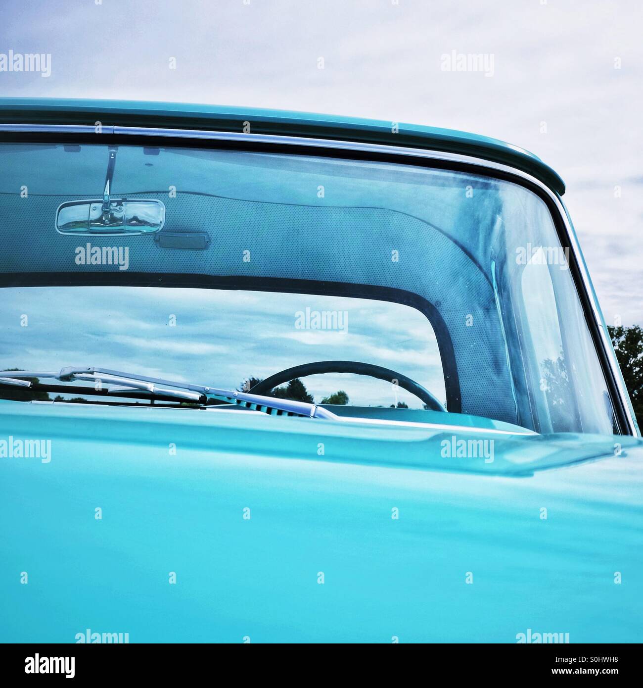 Blue car windscreen and steering wheel detail Stock Photo - Alamy