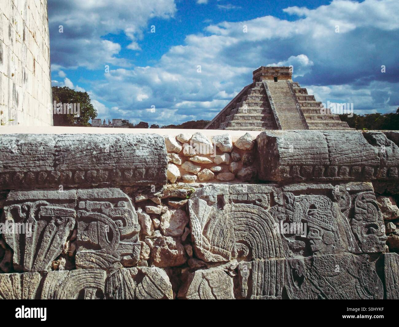 Mayan inscriptions with main Chichen Itza pyramid in background Mexico ...