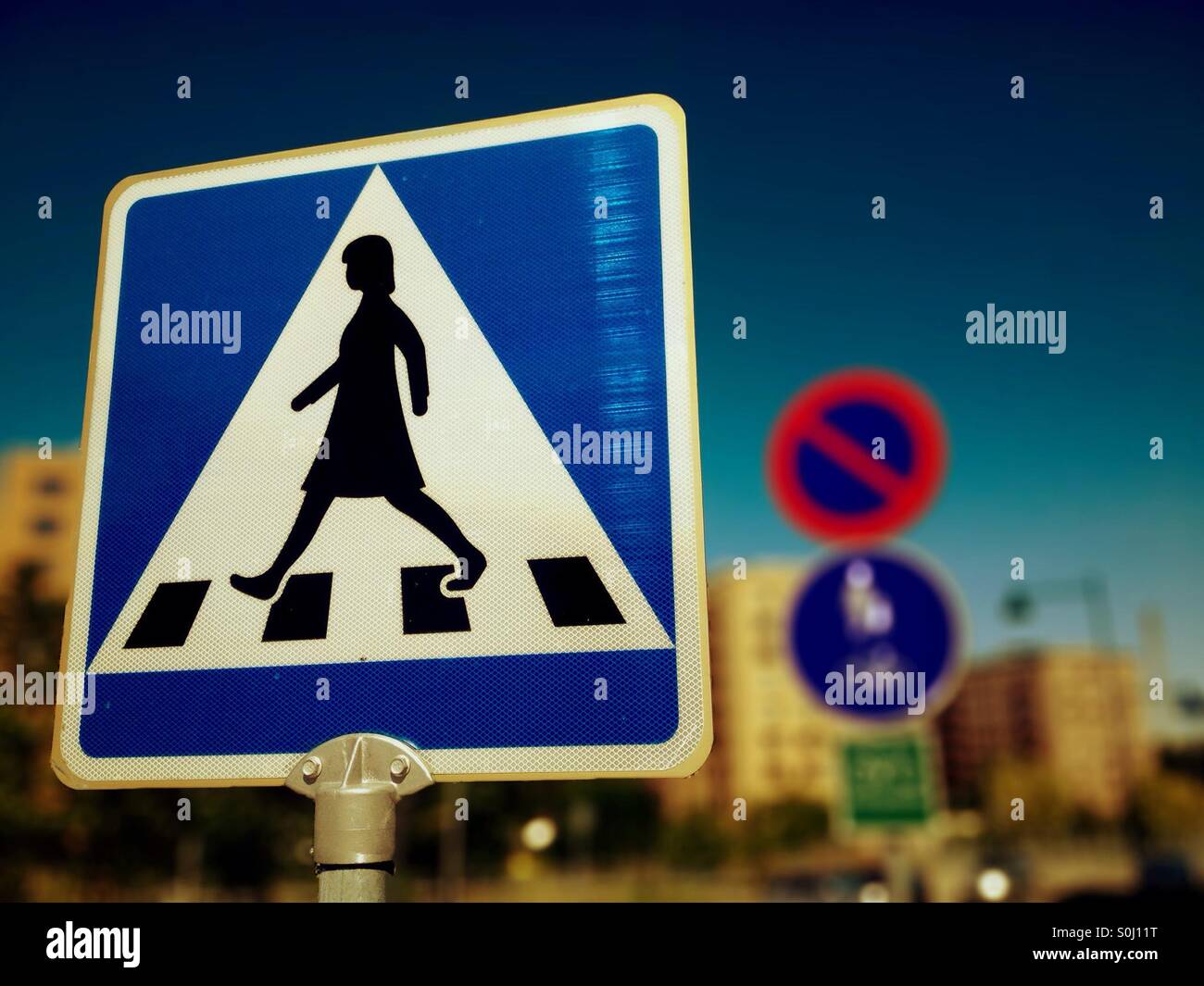 Pedestrian crossing in Sweden with Woman figure Stock Photo - Alamy