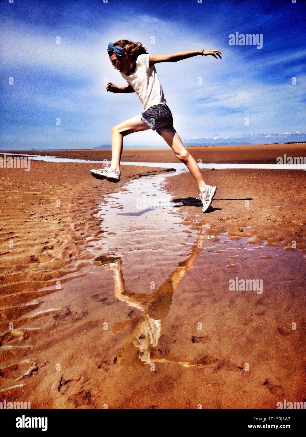 Child leaping water hi-res stock photography and images - Alamy