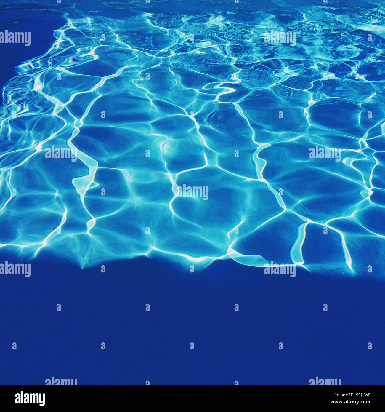 Swimming pool water Stock Photo - Alamy