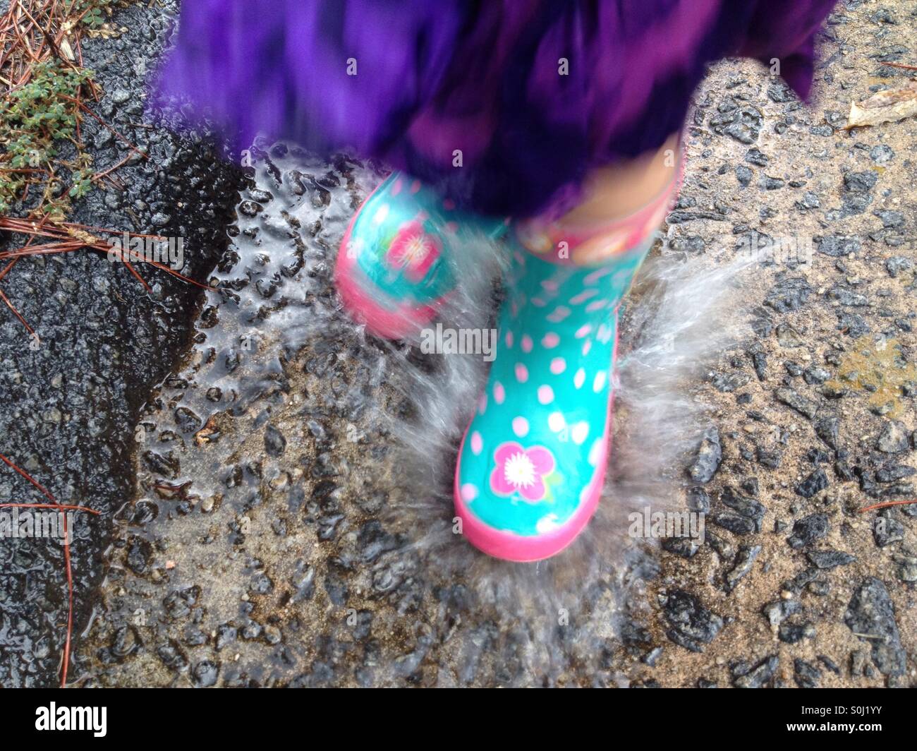 Rain boot splash Stock Photo - Alamy Rain boot splash Stock Photo - Alamy