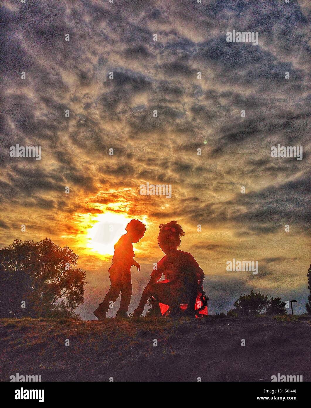 Sister and brother sunset hi-res stock photography and images - Alamy