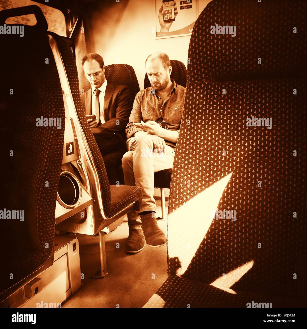 Two men sitting in train hi-res stock photography and images - Alamy