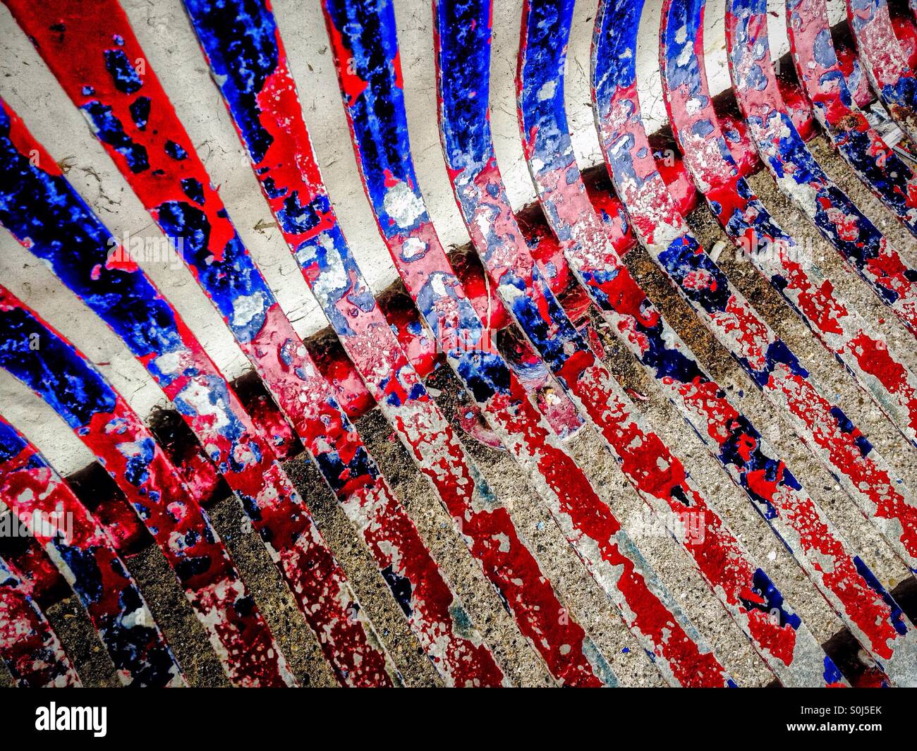 Flaking paintwork on an old metal bench seat Stock Photo - Alamy