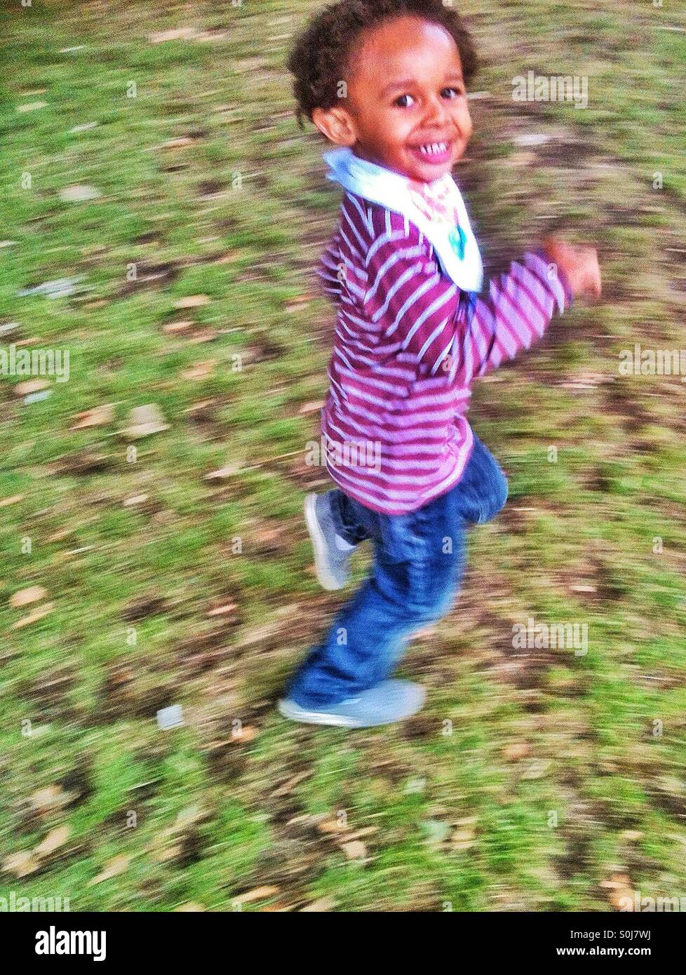 Child running away grass hi-res stock photography and images - Alamy