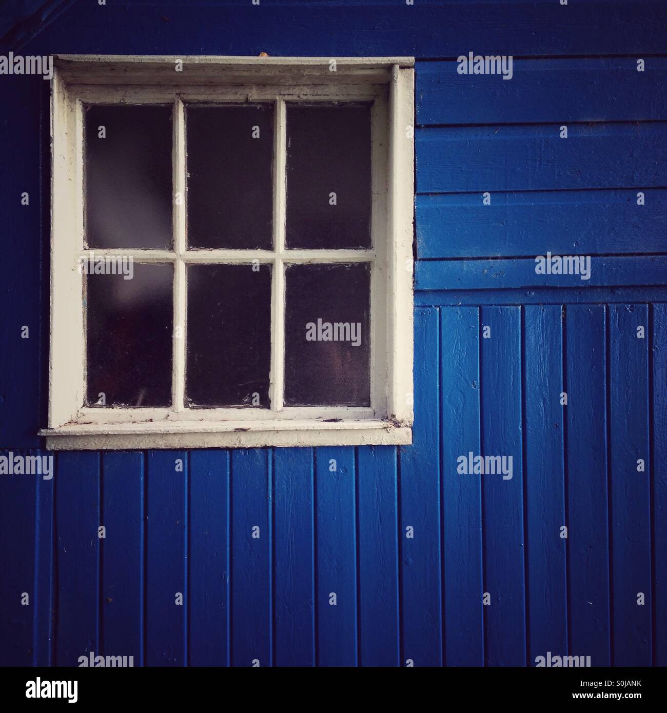 Blue and white fishing hut window Stock Photo - Alamy