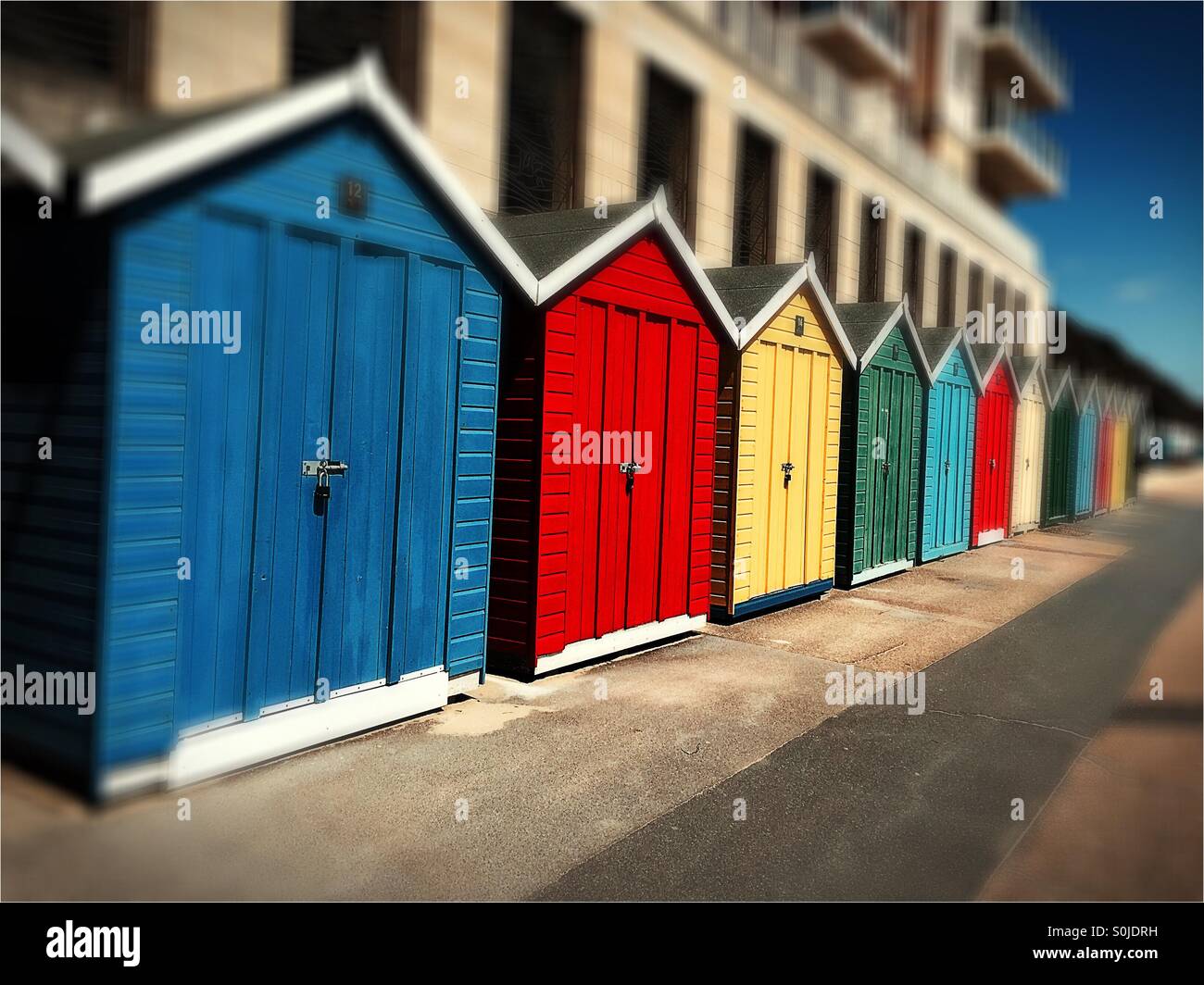 Colourful british beach huts hi-res stock photography and images - Alamy