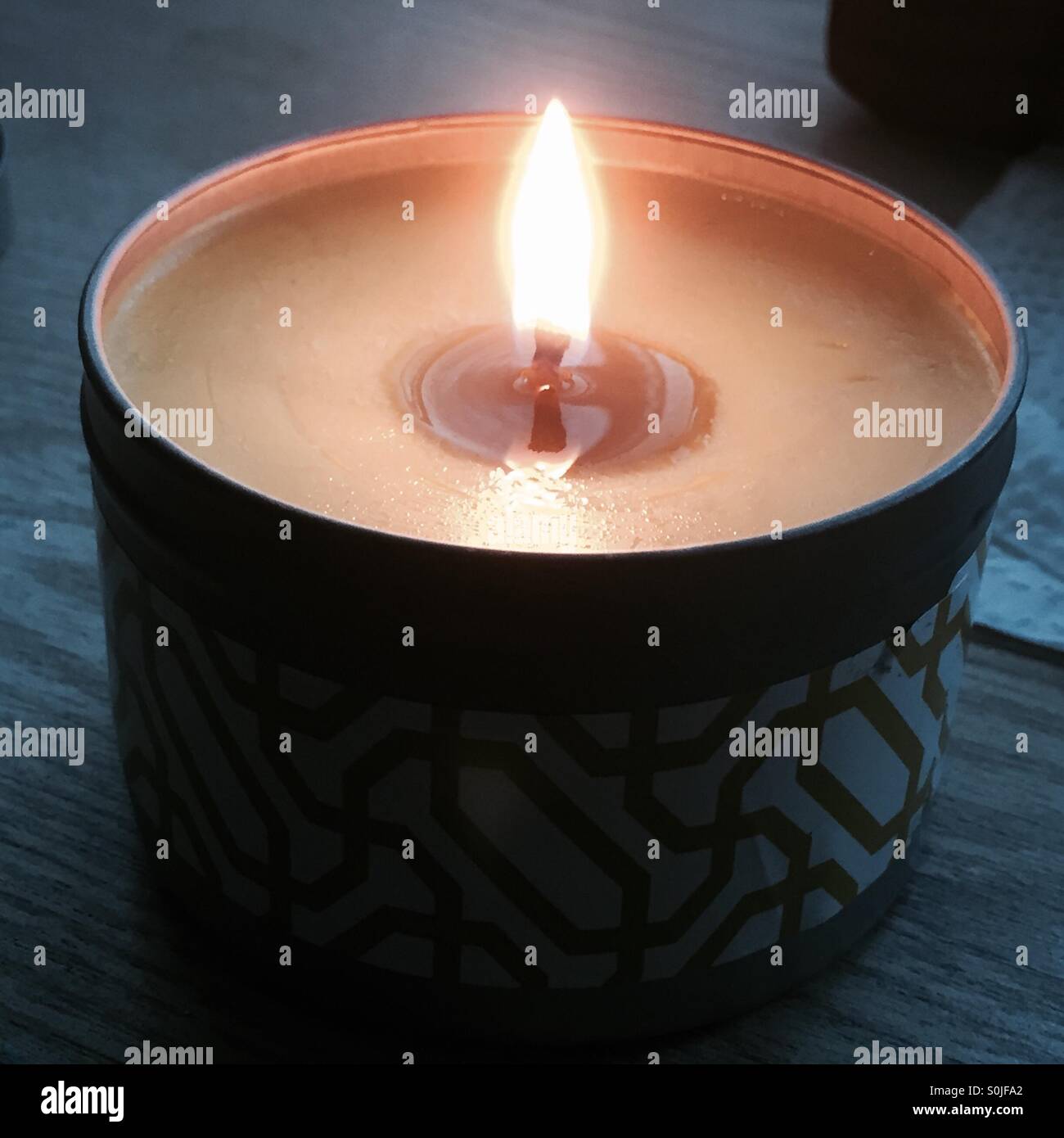 Candle in a tin can Stock Photo - Alamy